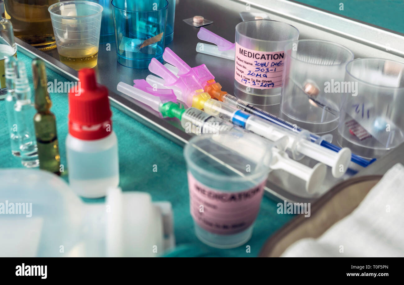 Different dosage medication in hospital, conceptual image, horizontal ...