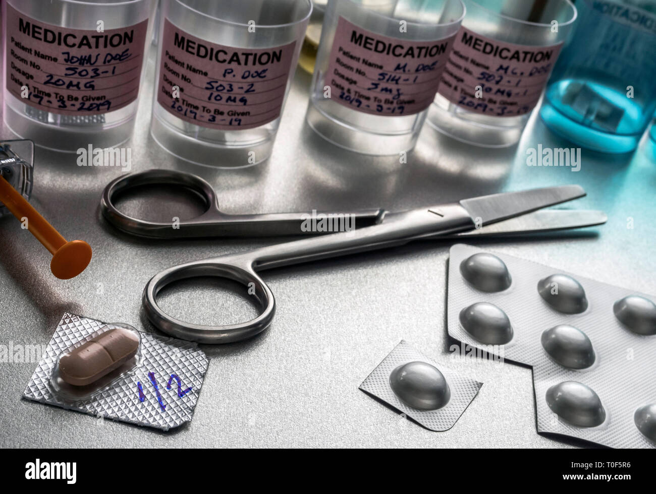 Different dosage medication in hospital, conceptual image, horizontal ...