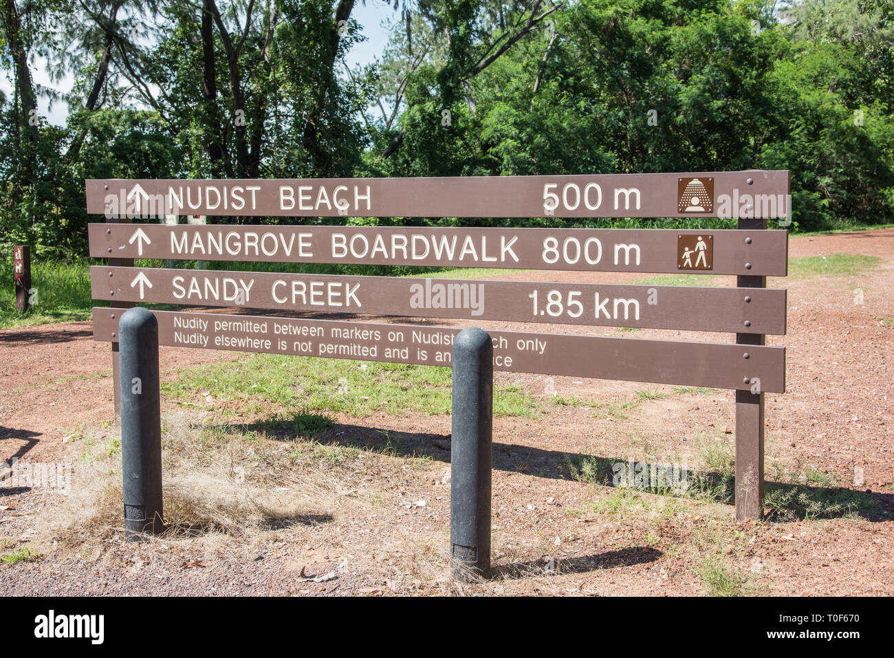 Signpost with distance indicators at the Casuarina Coastal Reserve in ...