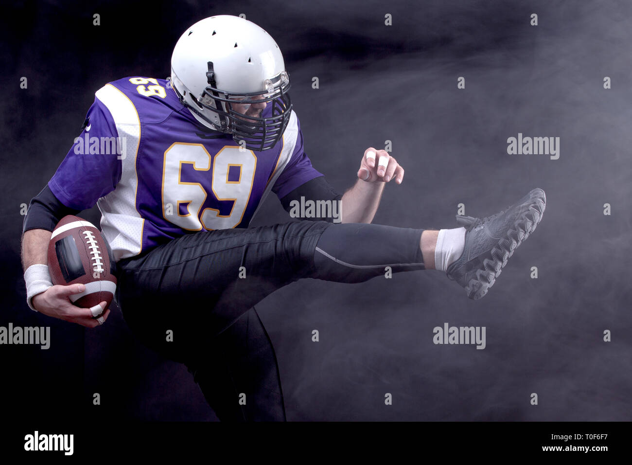High jump of American Footballer Stock Photo - Alamy