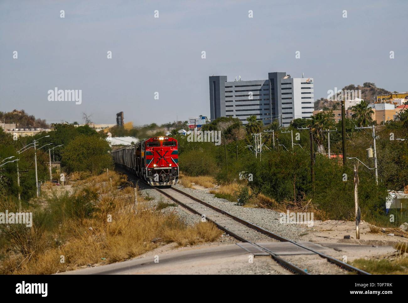 Train or Mexican railways passing through the popular colony in ...
