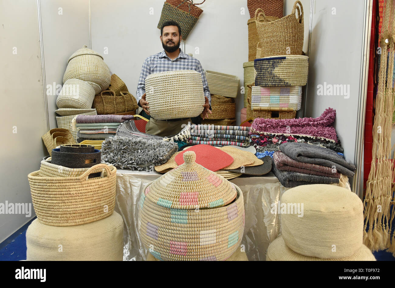 Dhaka, Bangladesh. 19th Mar, 2019. A salesperson shows products at a ...