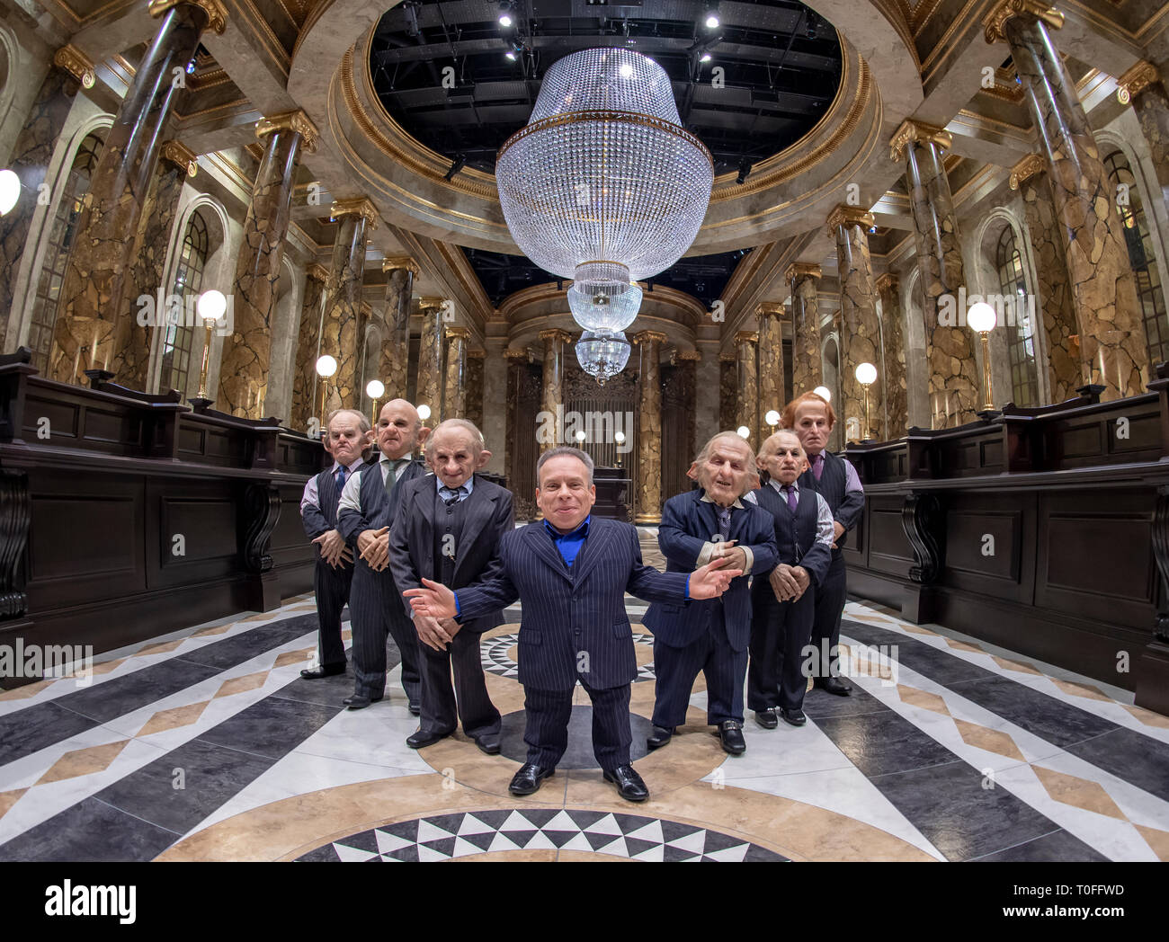 Warwick Davis (C) and Goblins in the original Gringotts Wizarding Bank ...