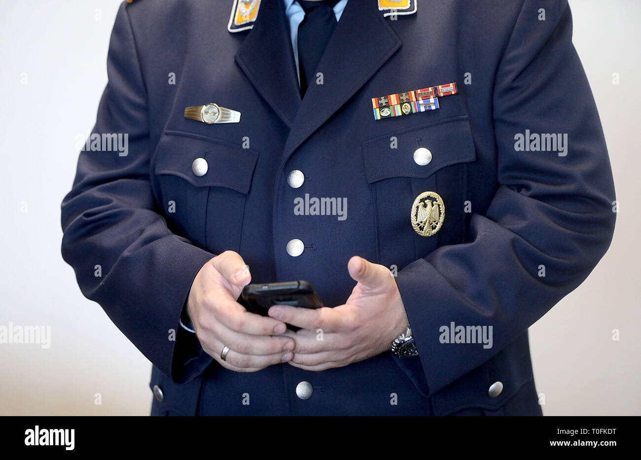 20 March 2019, North Rhine-Westphalia, Köln: An officer of the MAD ...