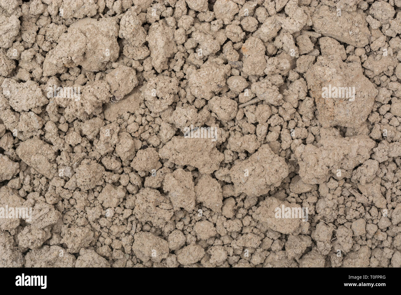 Wide-angle macro of bone-dry soil showing particulate & finest soil ...