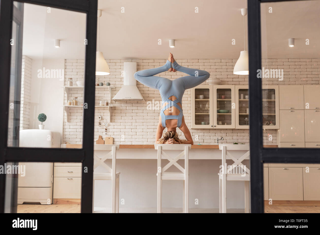 Strong muscled short-haired lady standing in unbelievable posture Stock ...
