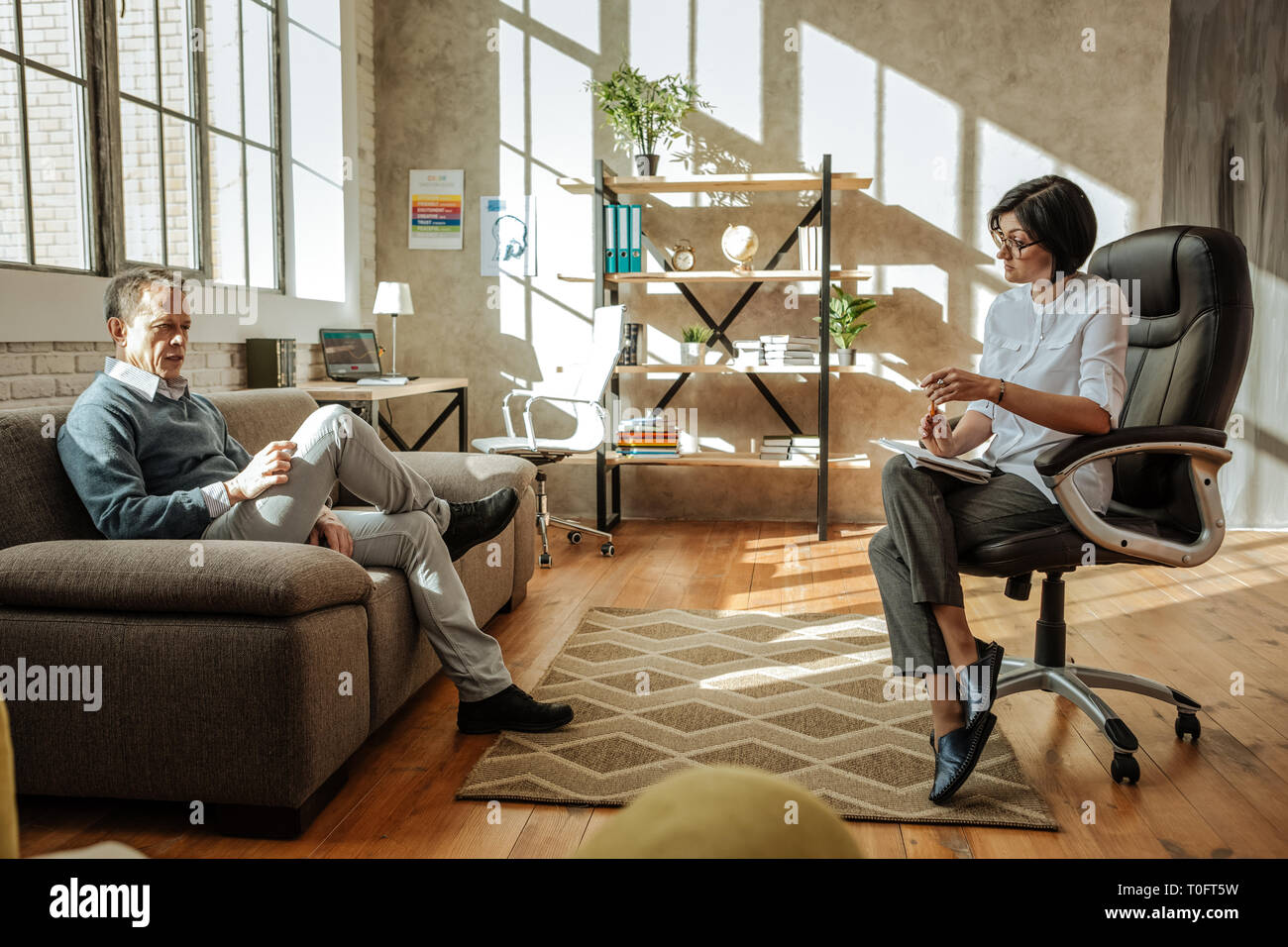 Dark-haired woman with bob haircut and her tidy client having ...