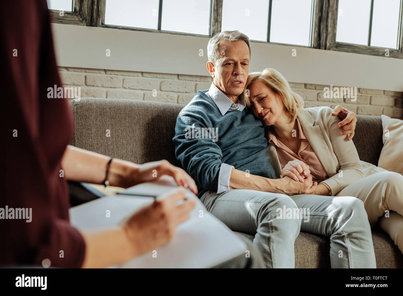 Desperate good-looking couple having crises in their relationship Stock ...