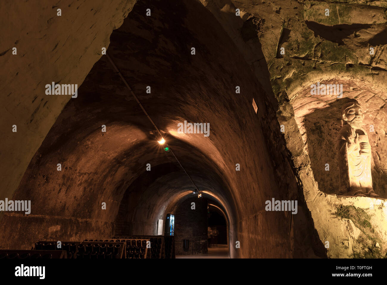 Historic chalk caves and cellars at house of Taittinger champagne ...