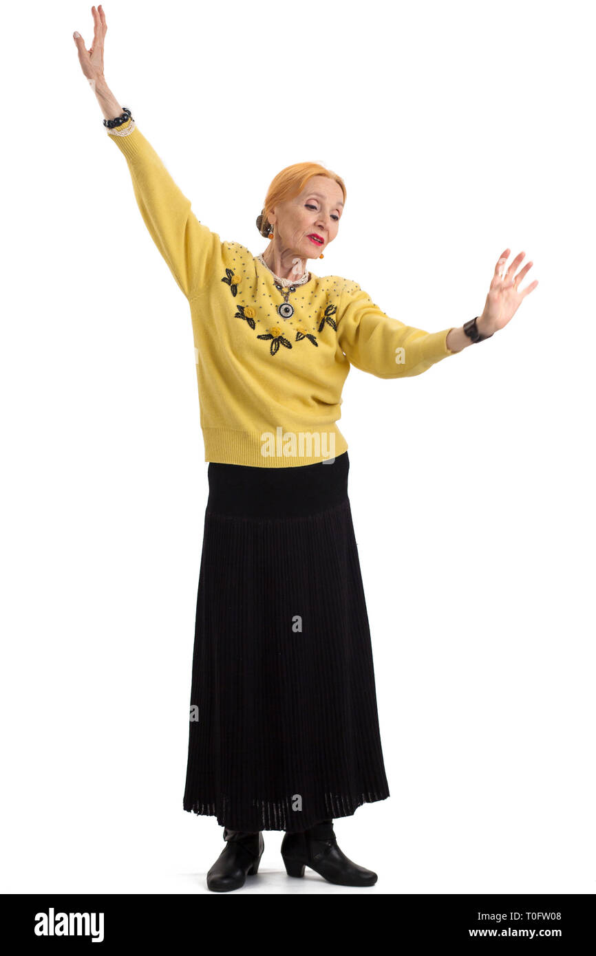 Senior woman dancing isolated. Lady with raised arm Stock Photo - Alamy
