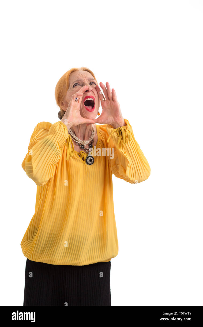 Senior woman shouting. Lady holding hands near mouth. Start a ...