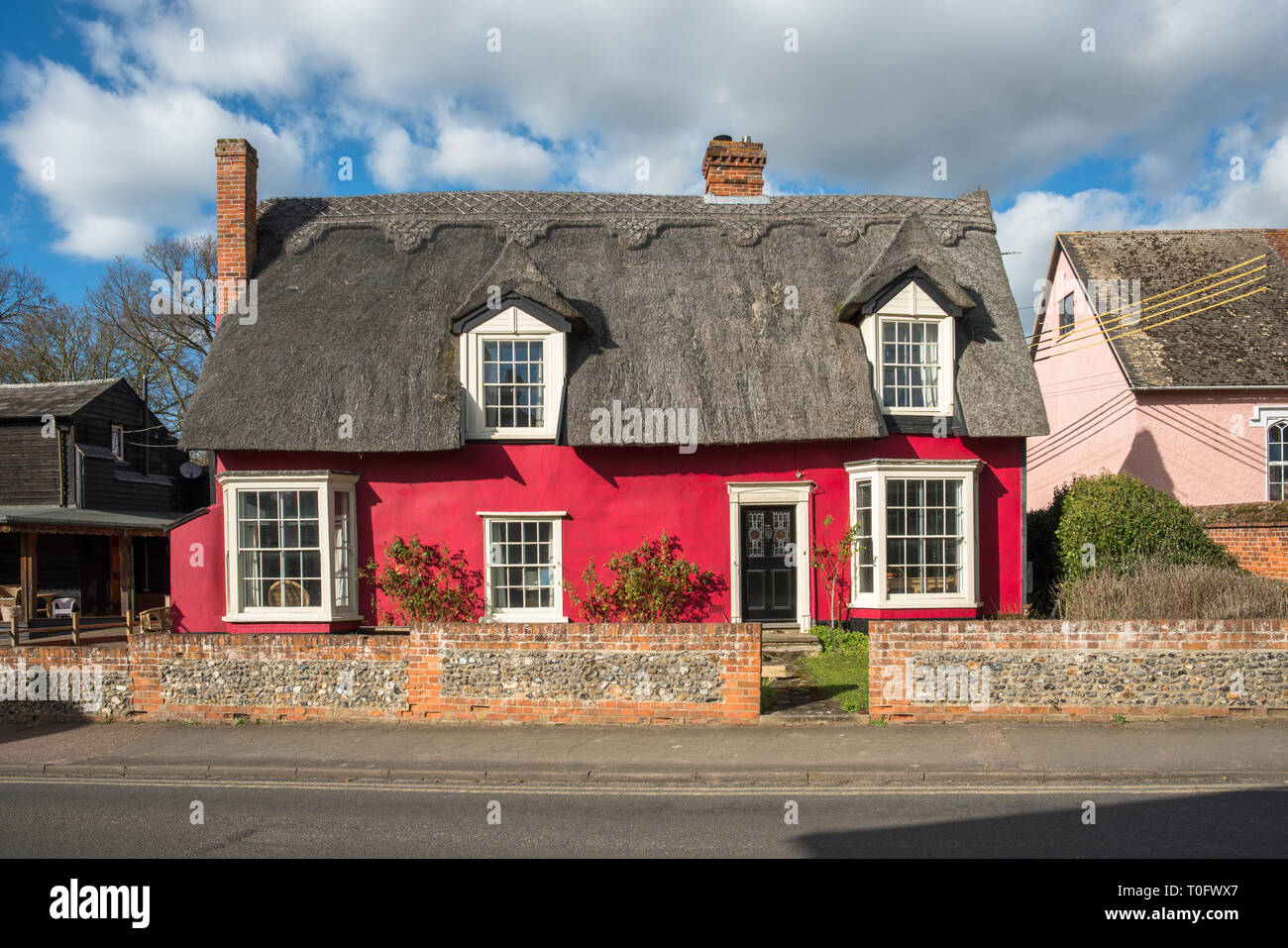 Picturesque red thatched cottage at Cavendish village in Suffolk, East ...