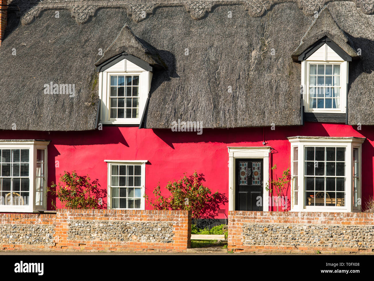 Pictureque red thatched cottage at Cavendish village in Suffolk, East ...