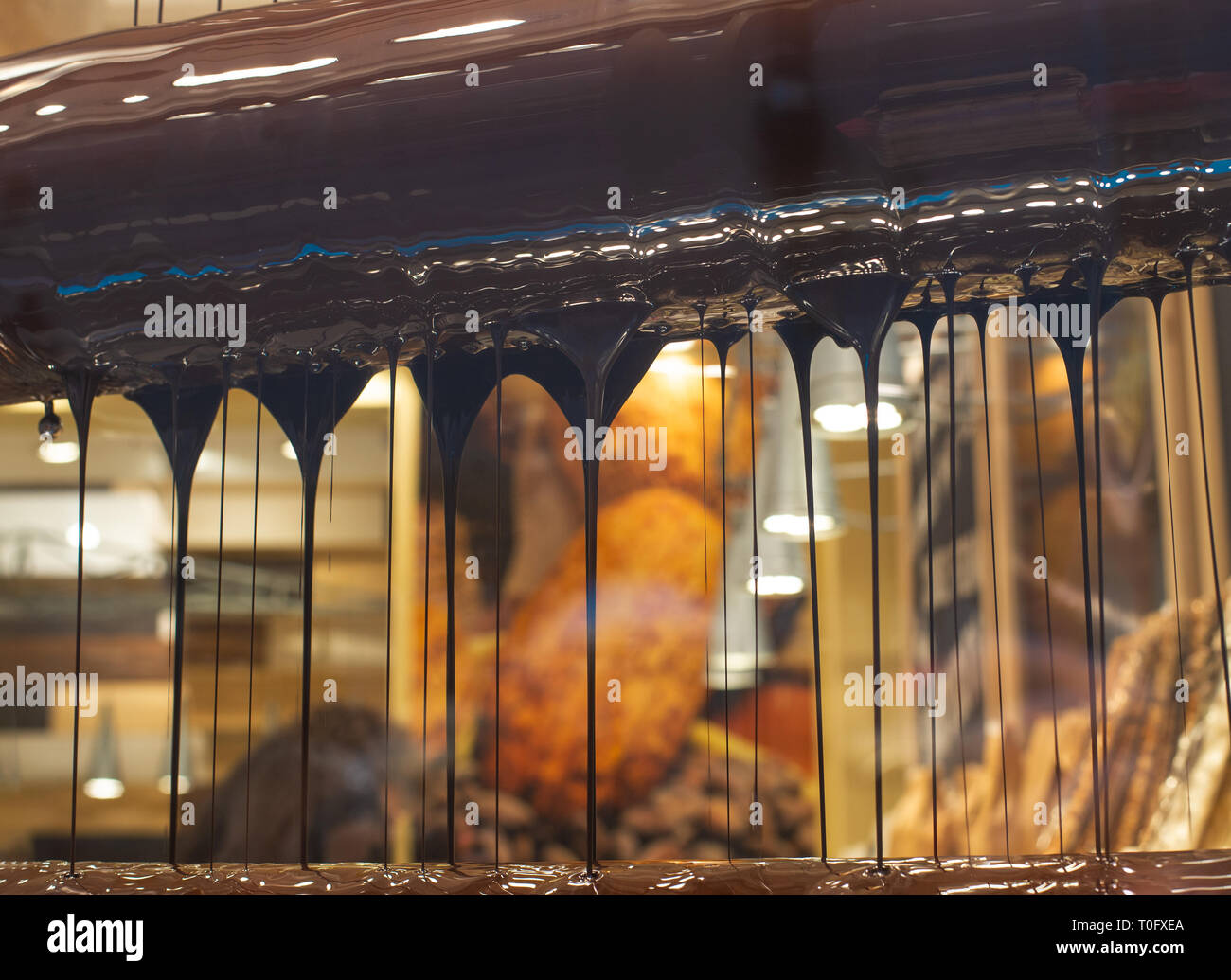 Showcase with flowing chocolate Stock Photo - Alamy