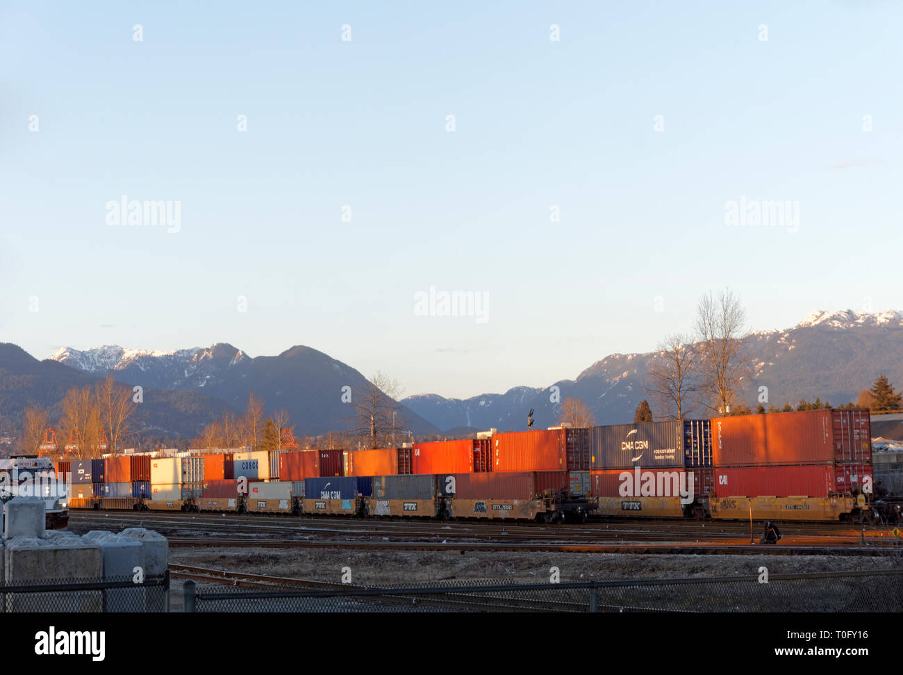 Shipping containers stacked at the railway yards hi-res stock ...