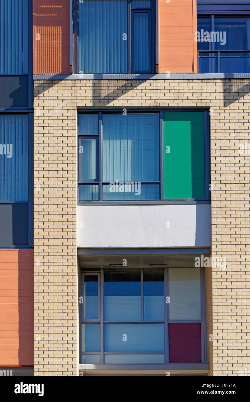 Brick facade of modern residential building with colorful decorative ...