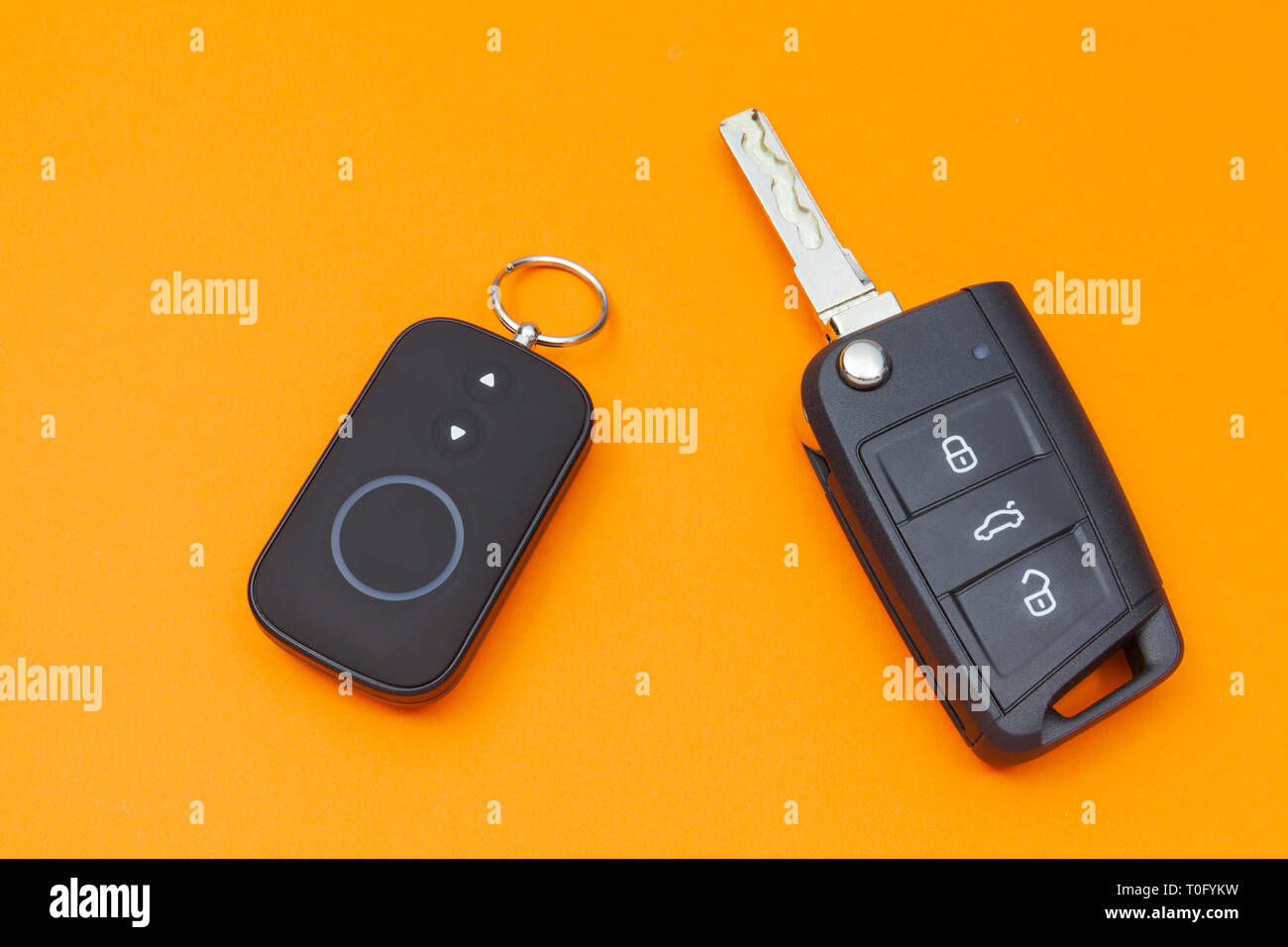 Opened Car Key with Remote Control on an orange background, top view ...