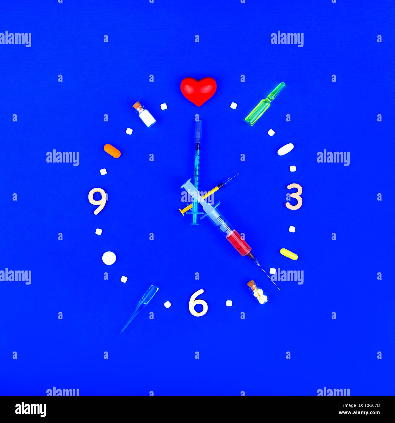 Medical pharmaceutical concept. Watch from tablets, ampoules and ...