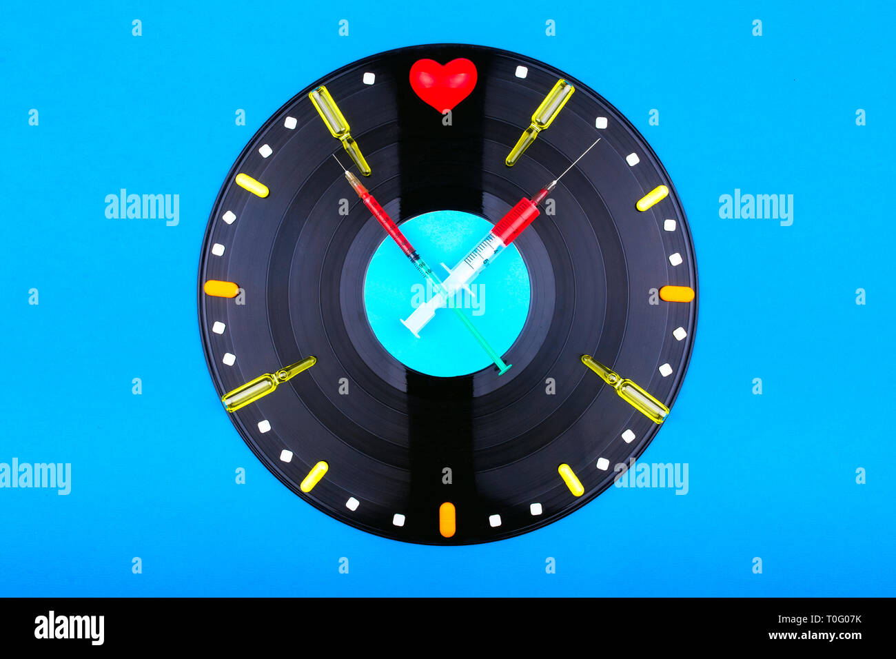 Medical pharmaceutical concept. Watch from tablets, ampoules and ...