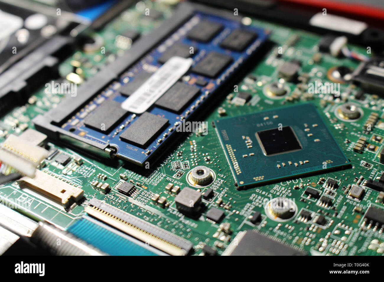 Closeup view at laptop motherboard and components. Processor and memory ...