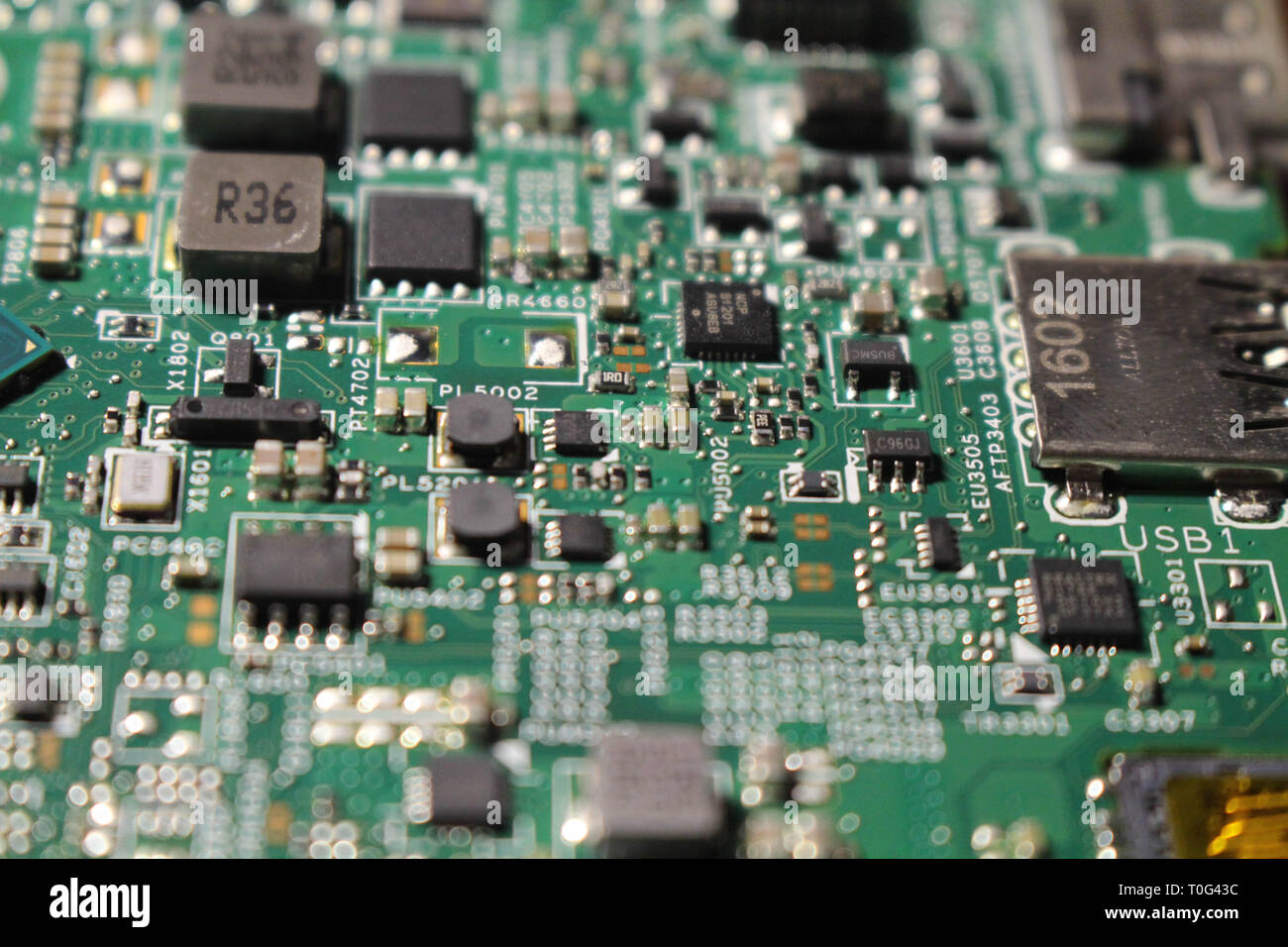 Closeup view at laptop motherboard and semiconductors components. Look ...