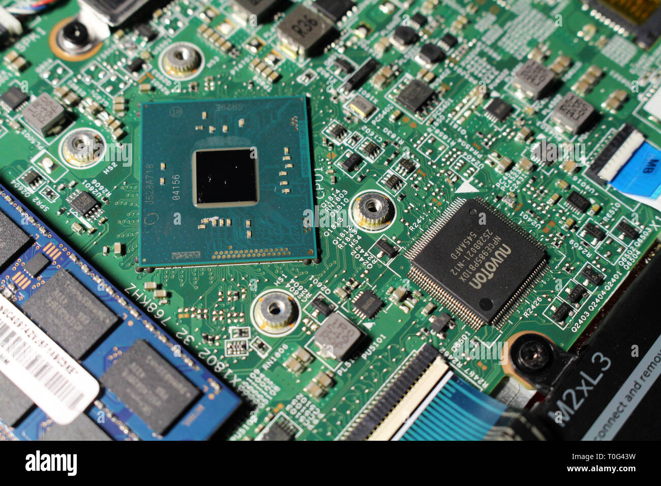Closeup view at laptop motherboard and components. Processor or CPU as ...