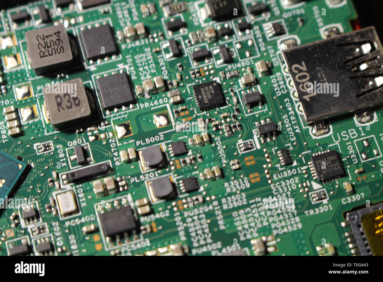 Closeup view at laptop motherboard and semiconductors components. Look ...