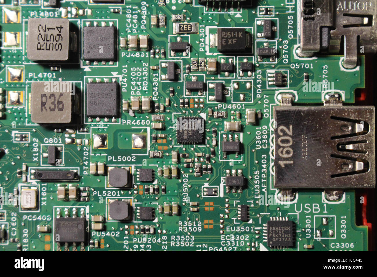 Closeup view at laptop motherboard and semiconductors components. Look ...