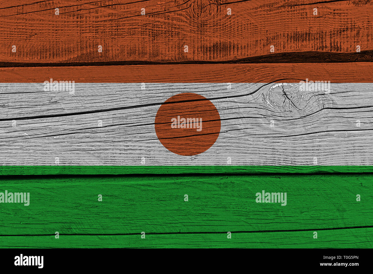 Niger flag painted on old wood plank. Patriotic background. National ...