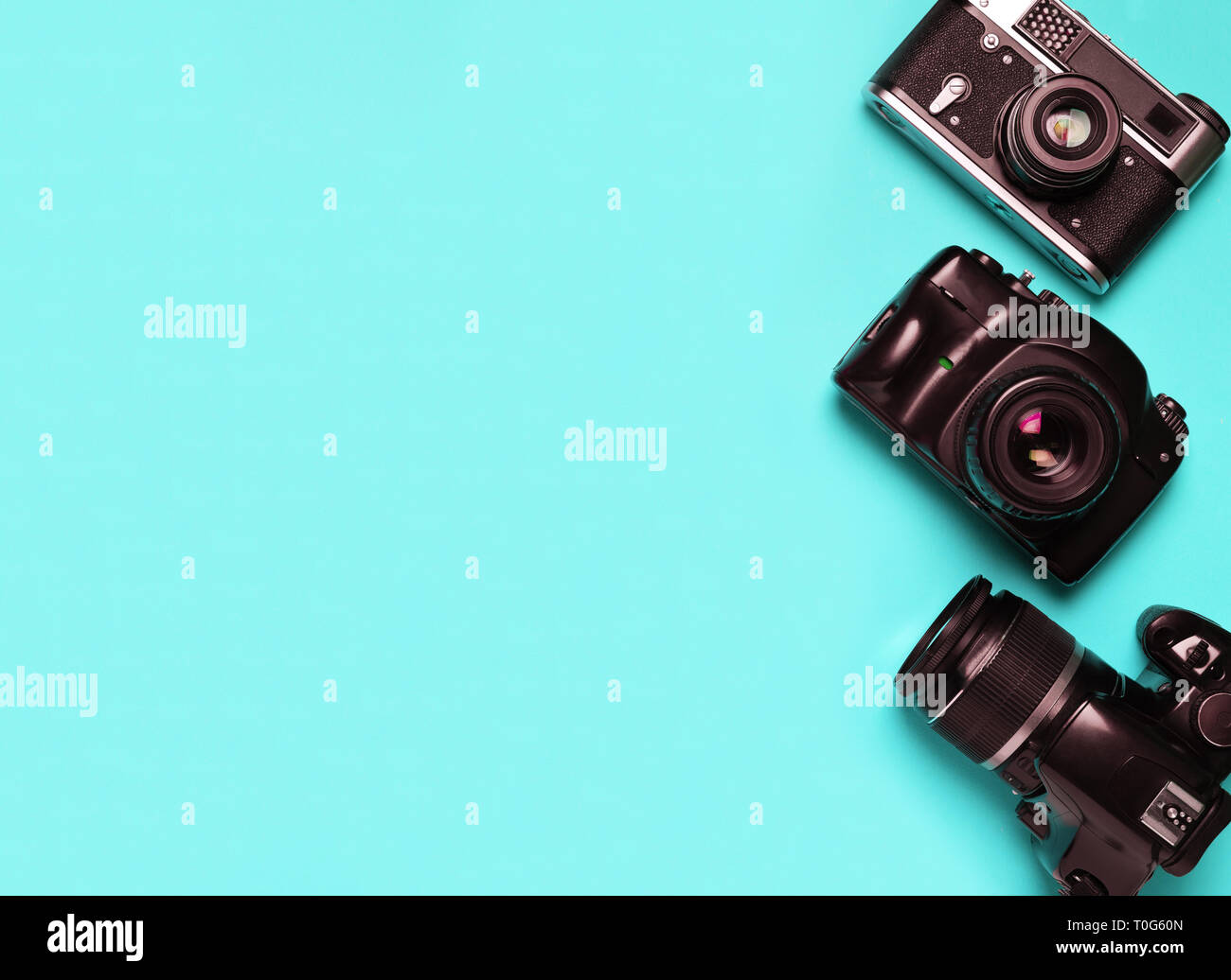 Vintage old photo camera on a blue background. Retro concept. Photo ...