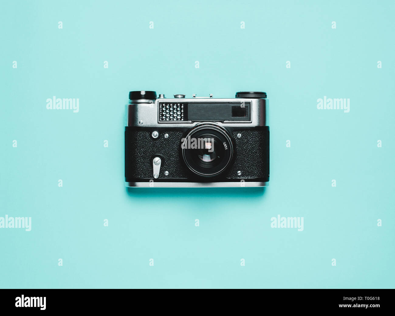 Vintage old photo camera on a blue background. Retro concept. View from ...