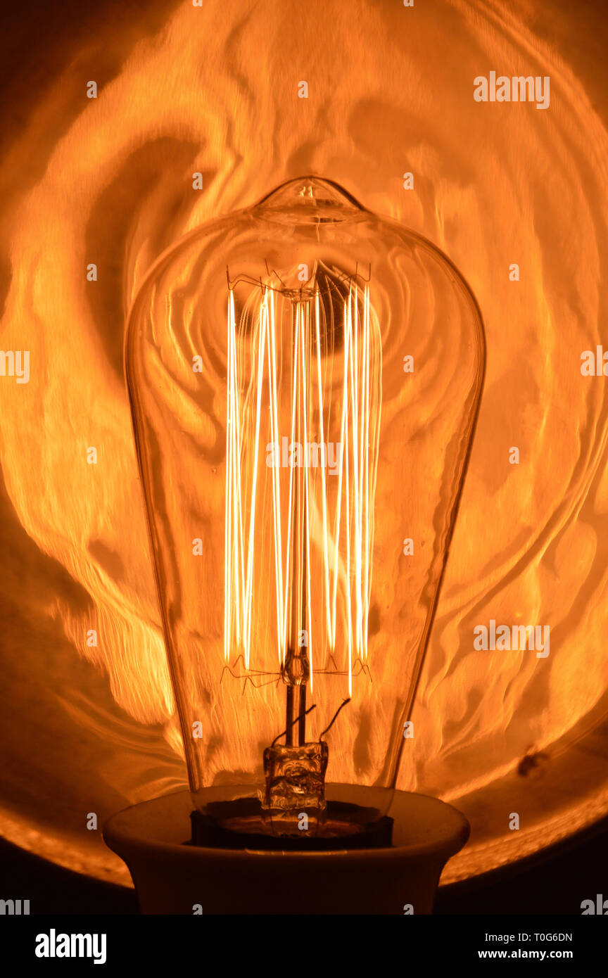 Antique bulb with electric filament Stock Photo - Alamy