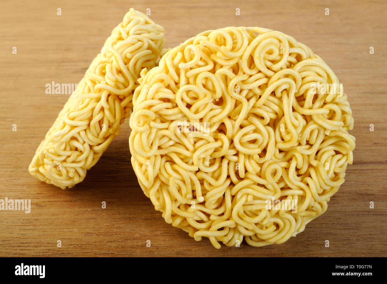 dry instant noodle on wooden background Stock Photo - Alamy