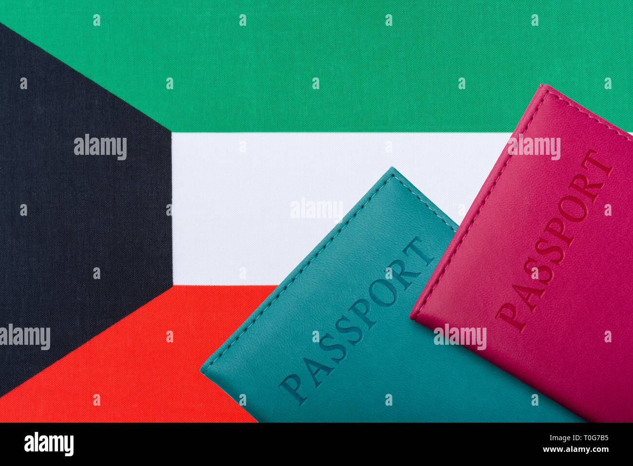 On the background of the flag of Kuwait passport. The concept of travel ...