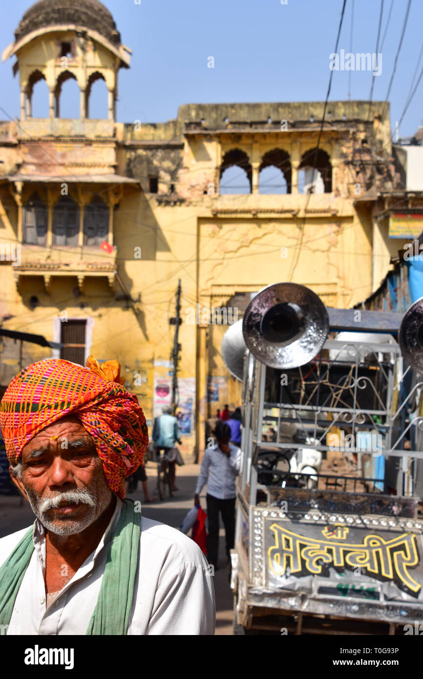 Old Indian Gentleman in turban in front of ancient archway gateway ...