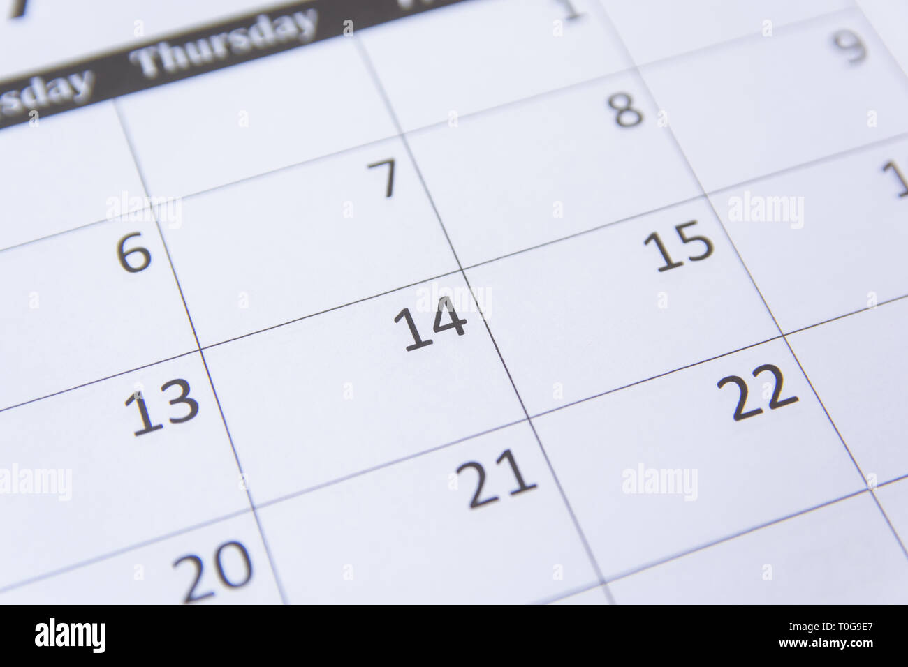 14th numbers on calendar page close up background Stock Photo - Alamy
