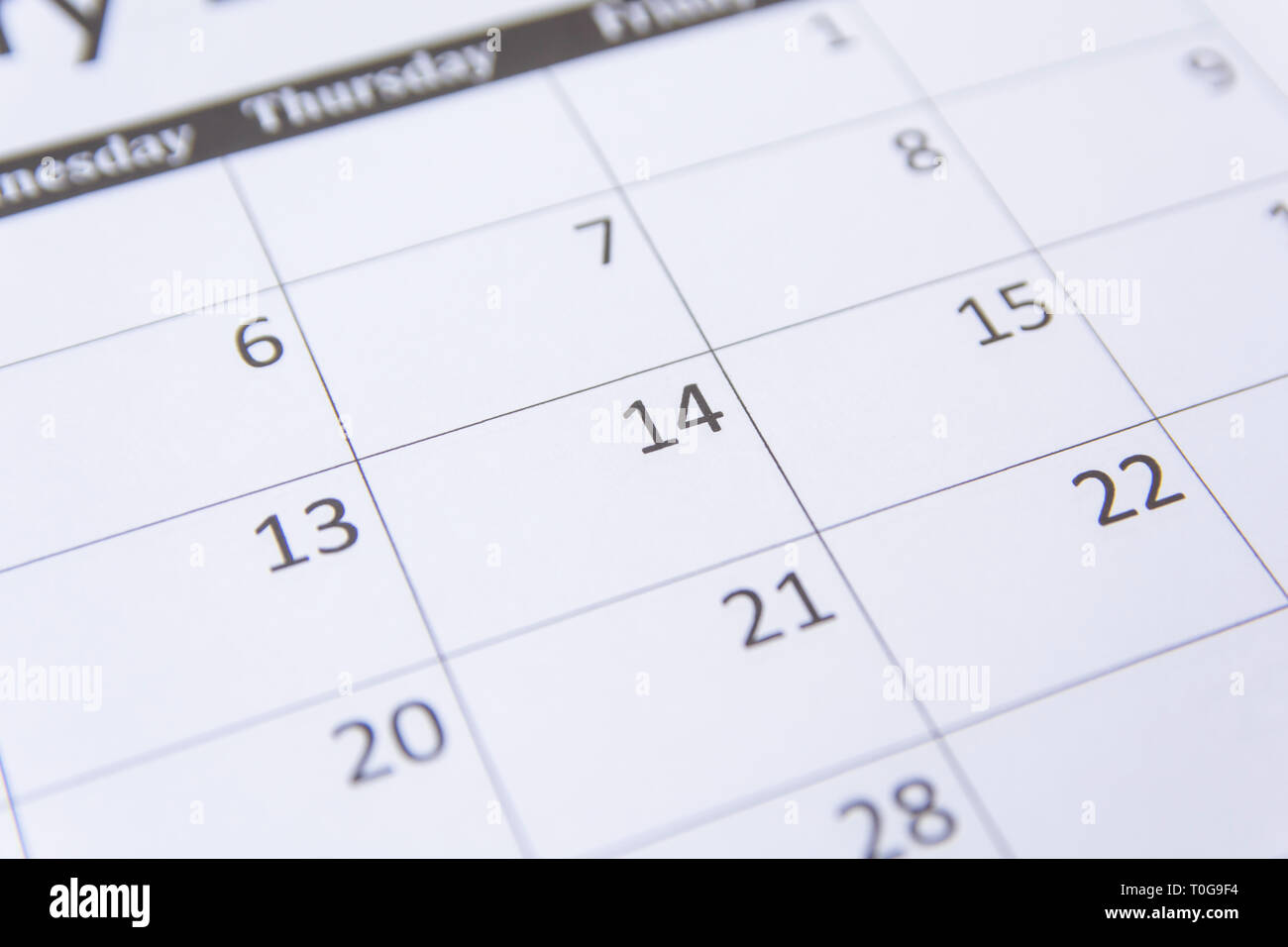 14th numbers on calendar page close up background Stock Photo - Alamy