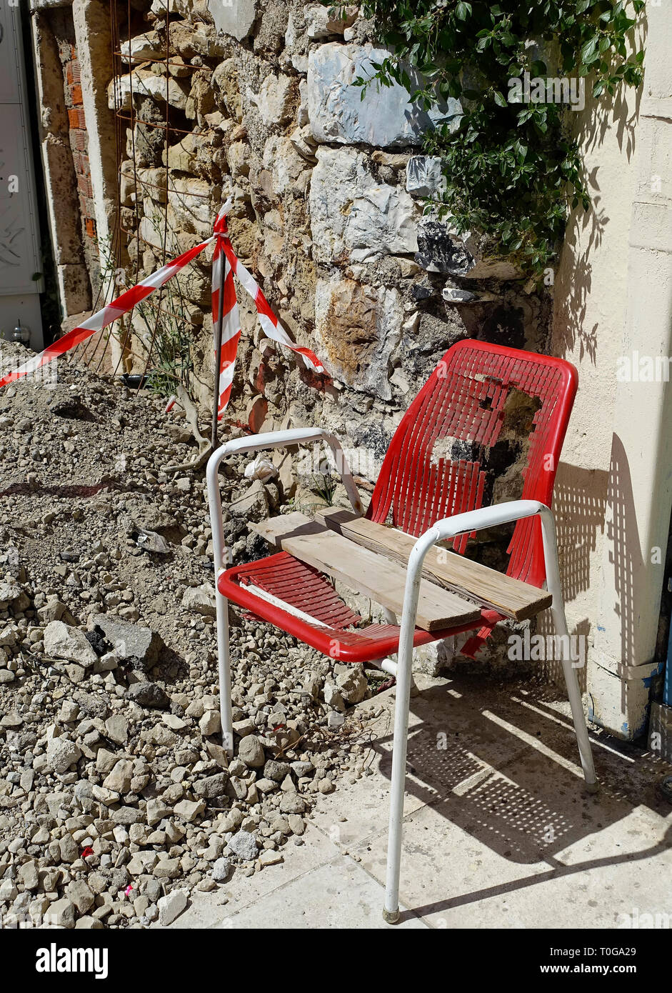 Old broken plastic chair in front of a ruin, Corfu, Greece Stock Photo ...