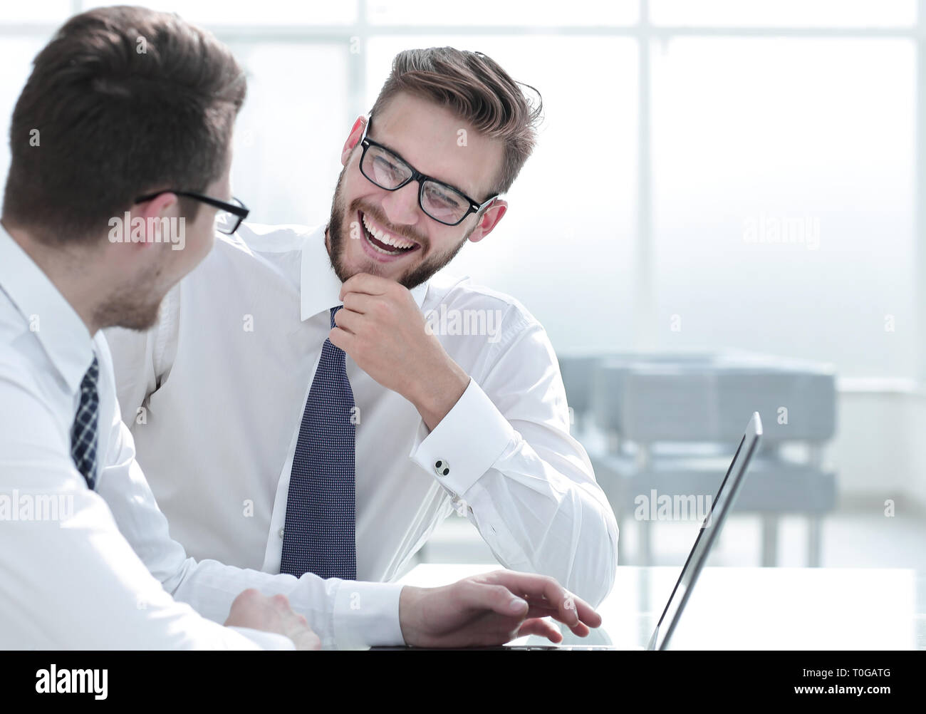 close up.employees working with a laptop in the office Stock Photo - Alamy