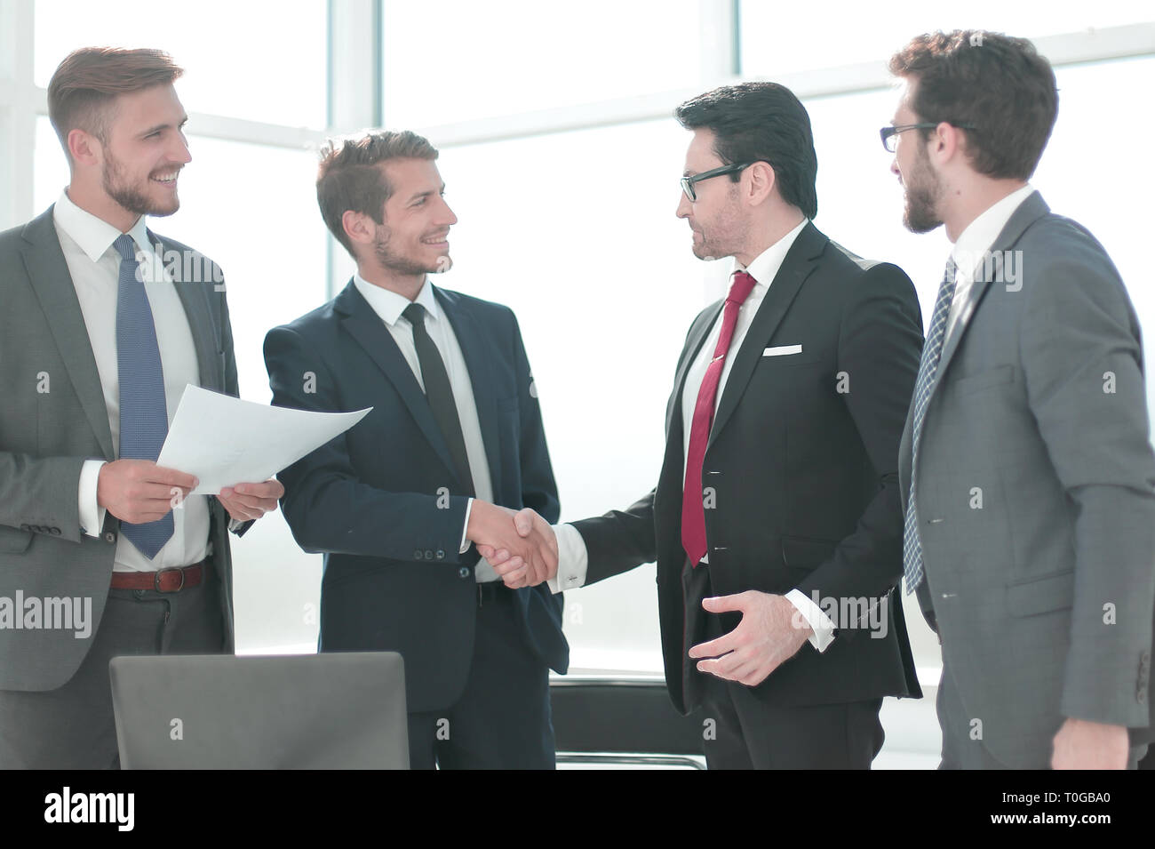 handshake business partners standing in the office Stock Photo - Alamy