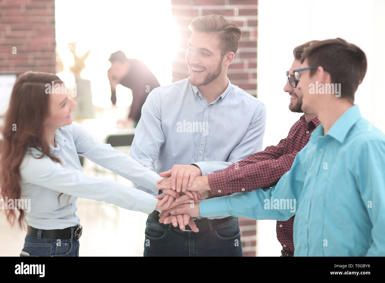Group of people hands together partnership teamwork Stock Photo - Alamy