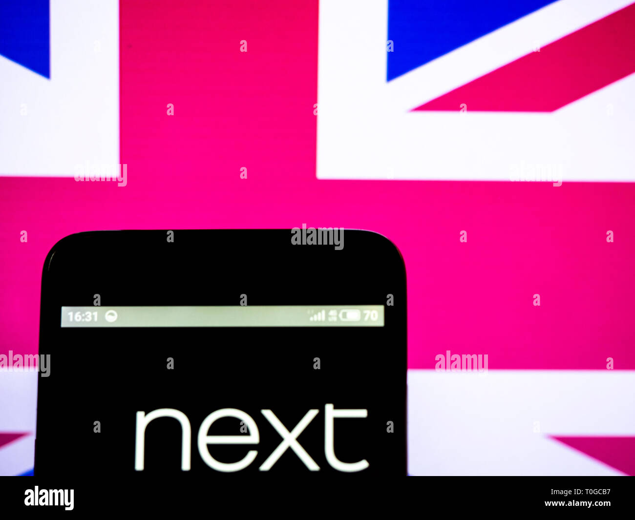 Next plc company logo seen displayed on smart phone Stock Photo - Alamy