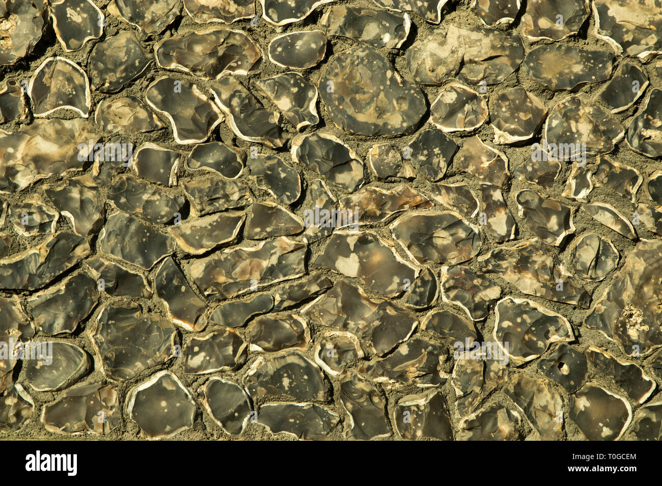 Fragment of a wall with unfinished granite. Wall Cladding Southwark ...