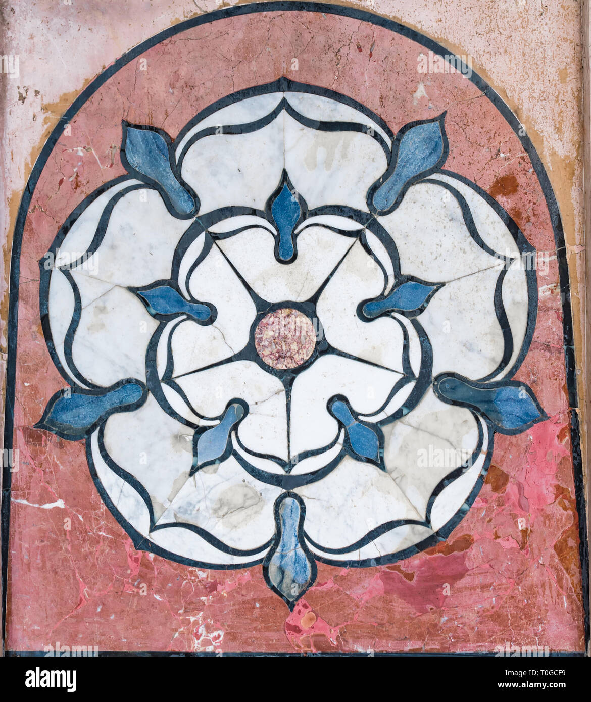 White and blue flower made using different colored marble as a mosaic ...