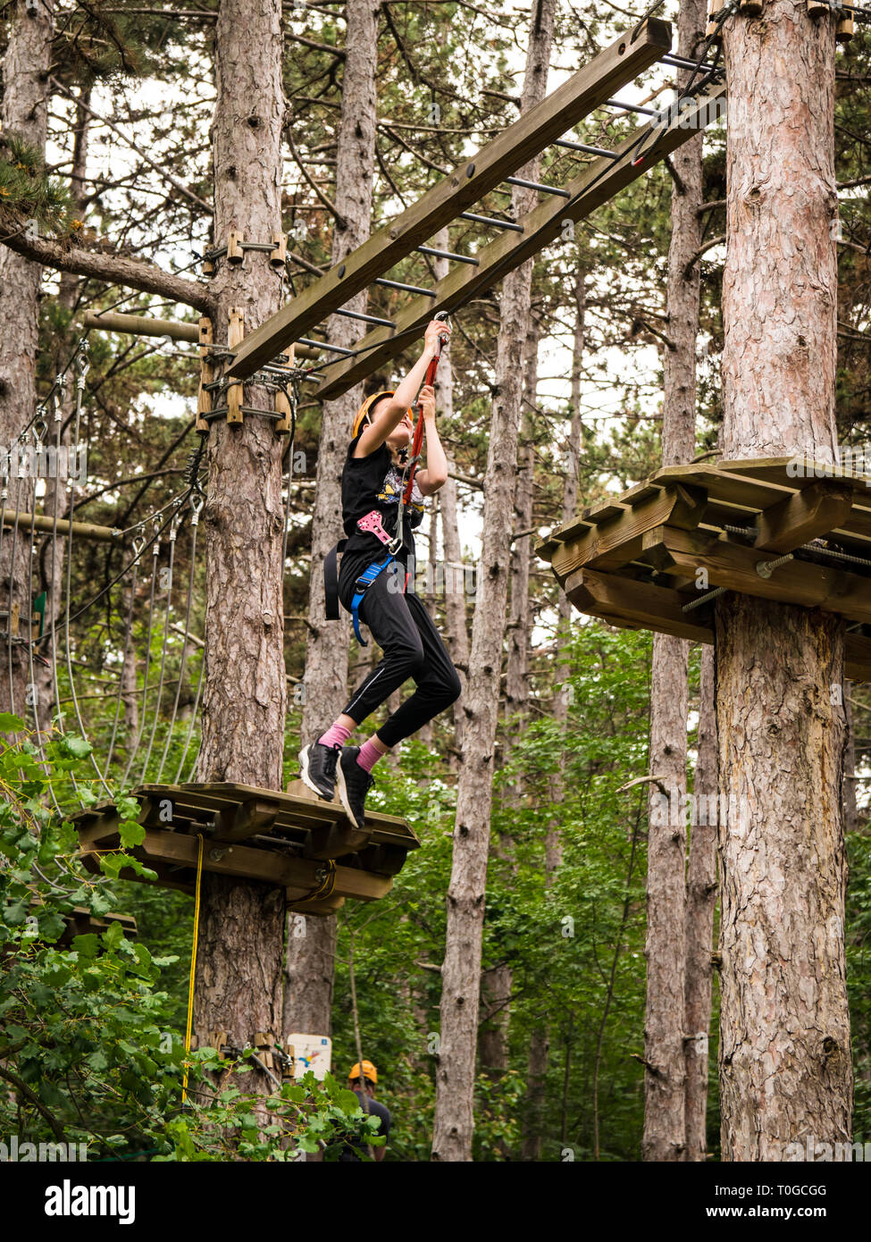 Child hanging rope hi-res stock photography and images - Alamy