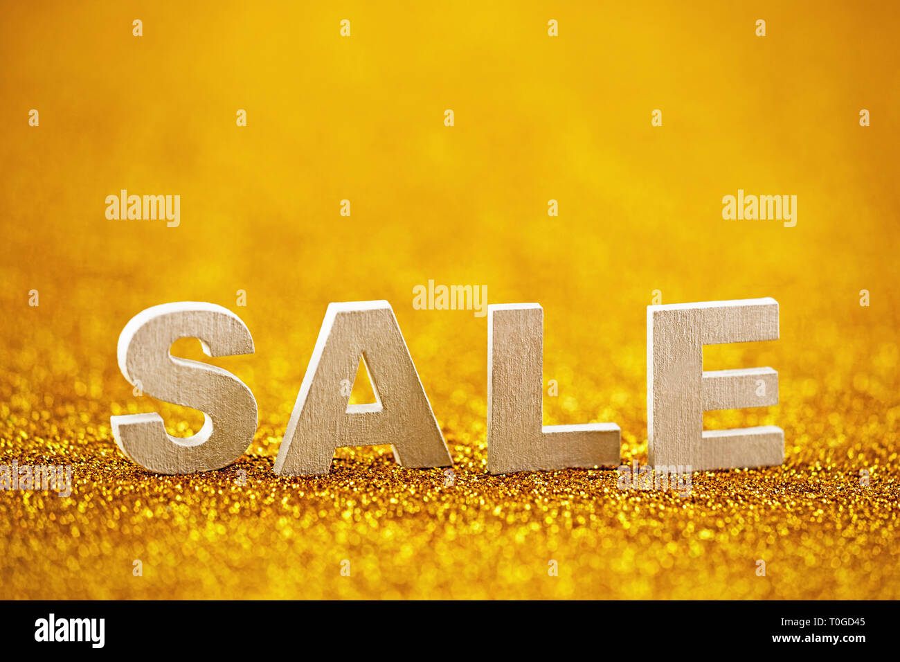 Word sale over golden glitter background Stock Photo - Alamy
