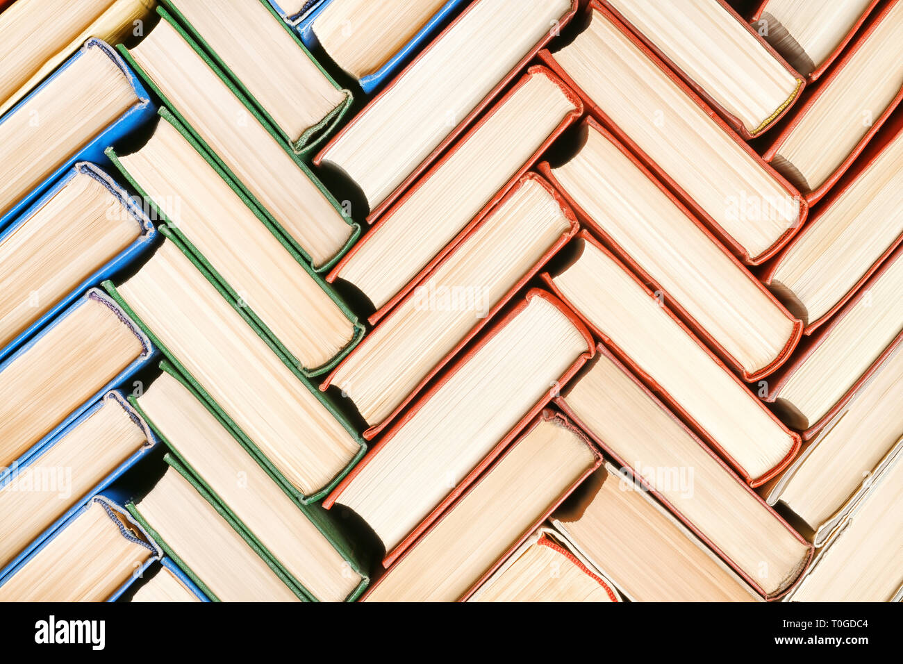 Books stack texture and background Stock Photo - Alamy