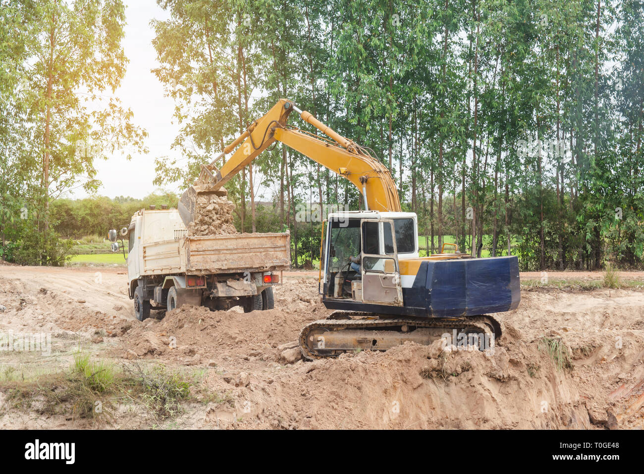 Excavator loading truck hi-res stock photography and images - Alamy