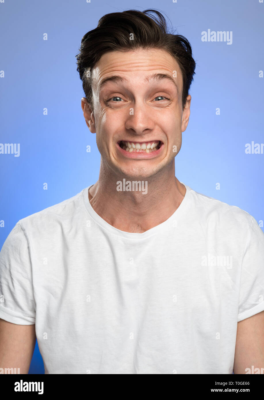 portrait series of a young white man with different facial expressions ...