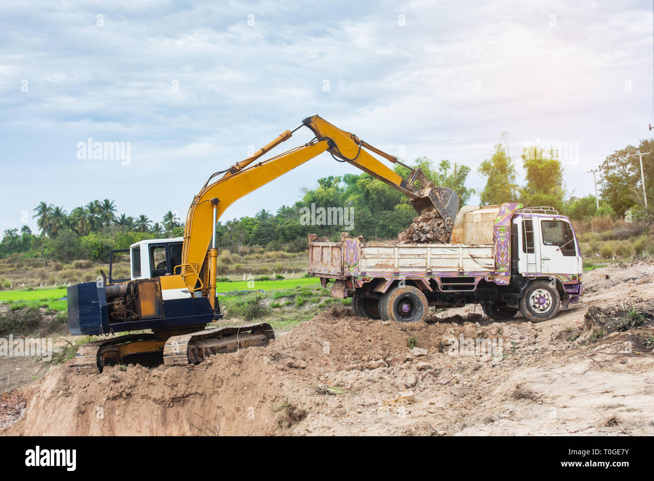 Excavator loading truck hi-res stock photography and images - Alamy